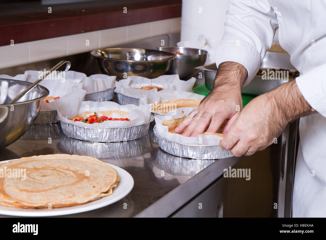 cook at work in a kitchen restaurant Stock Photo - Alamy