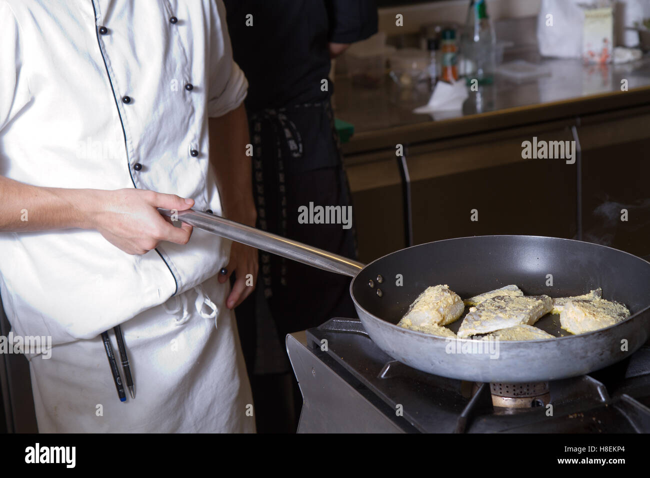 cook at work in a kitchen restaurant Stock Photo - Alamy