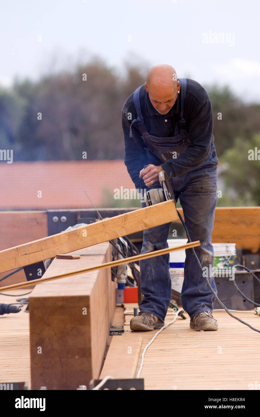 bricklayer working in a building site Stock Photo - Alamy