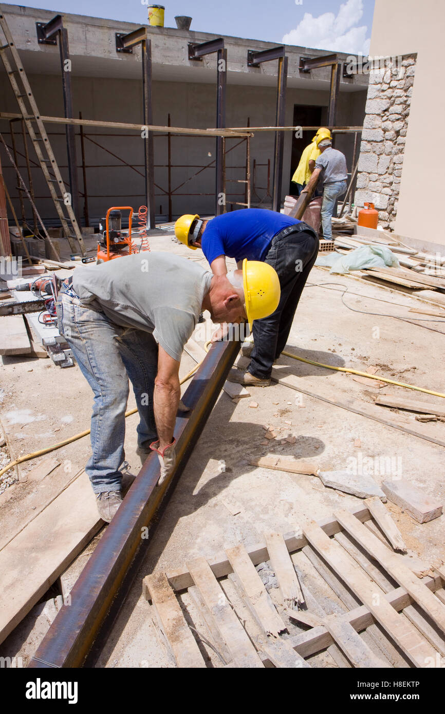 bricklayer working in a building site Stock Photo - Alamy