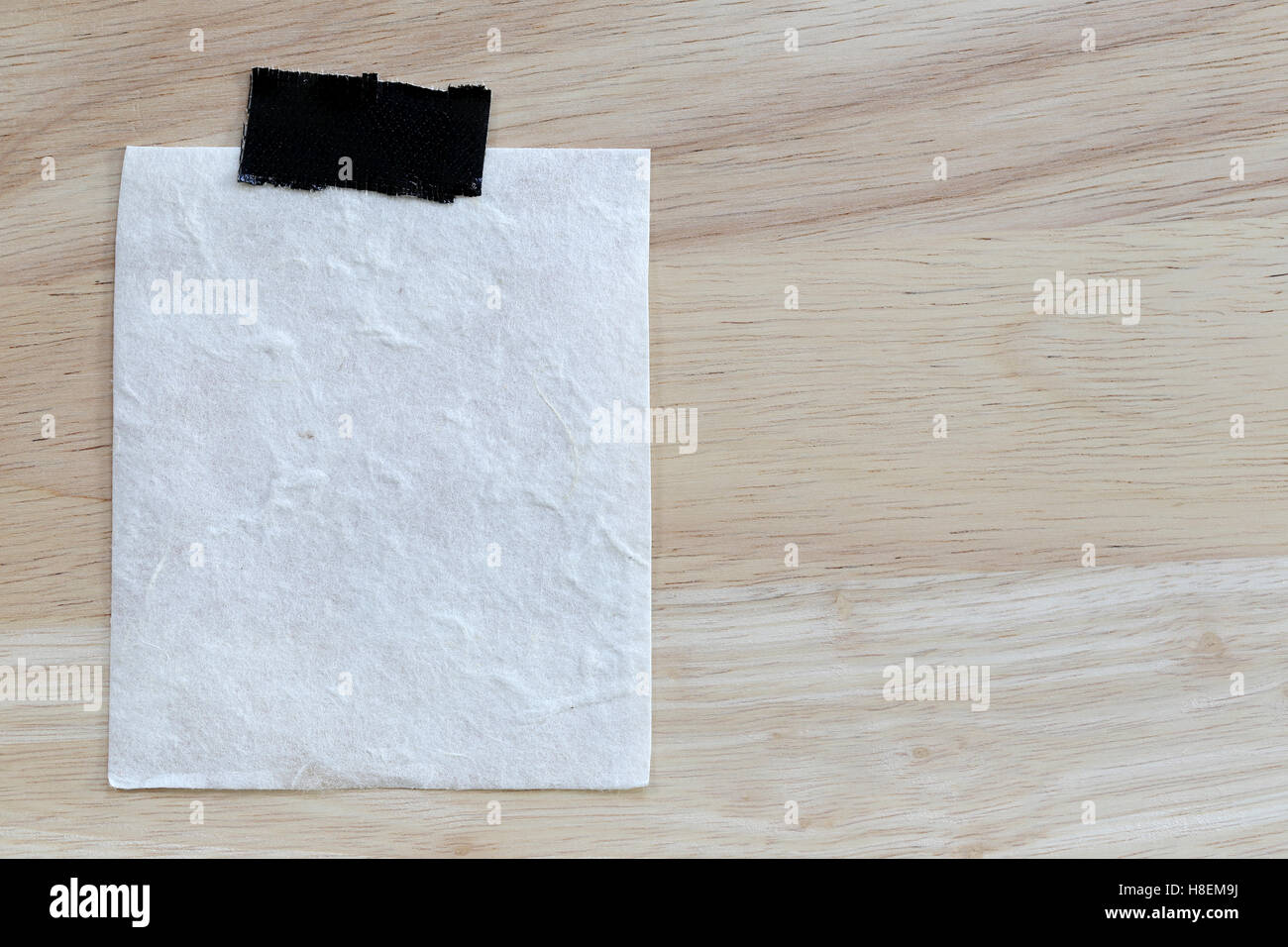 vintage of note paper on wooden background and copy specs you can input ...