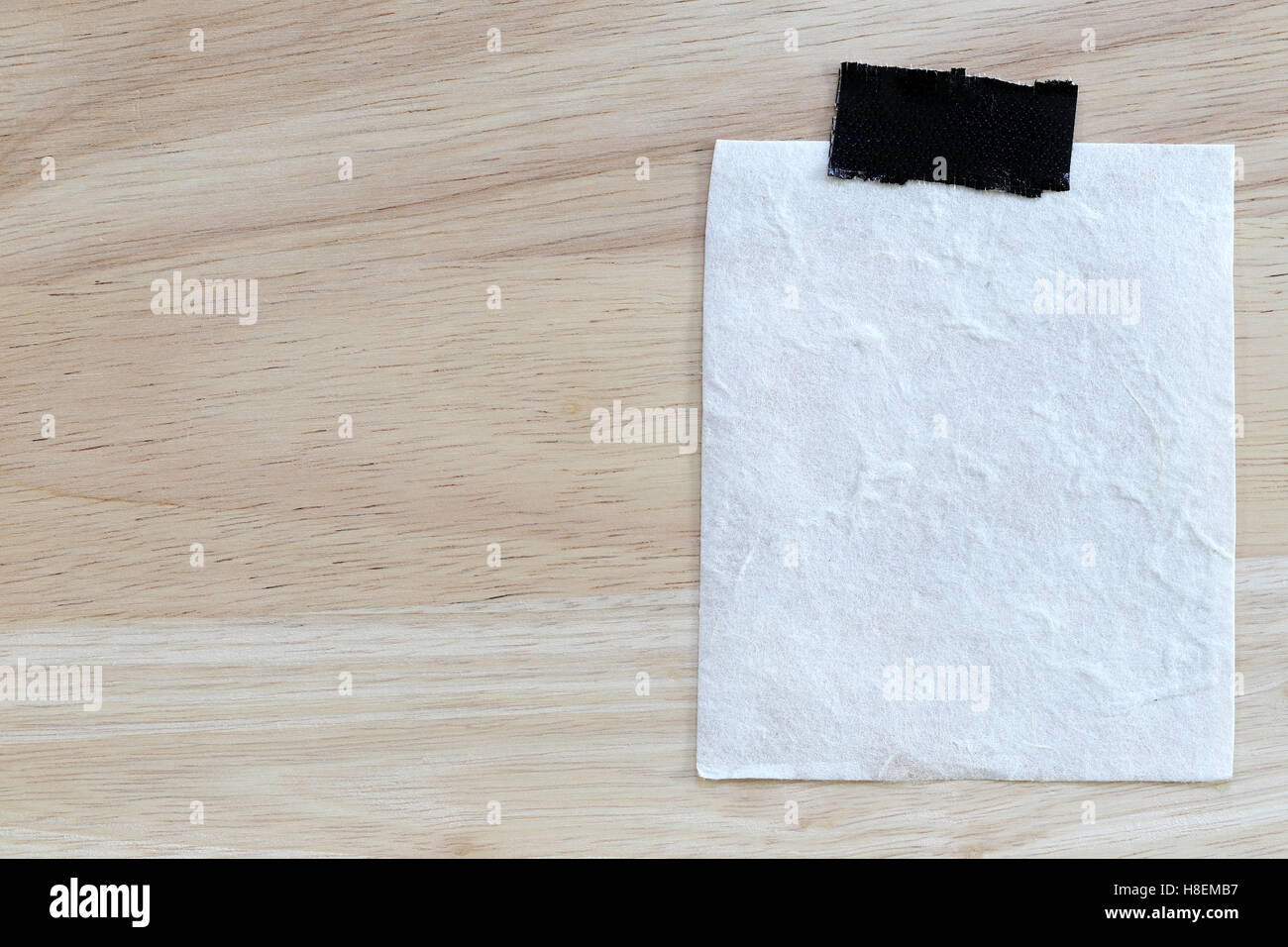 vintage of note paper on wooden background and copy specs you can input ...