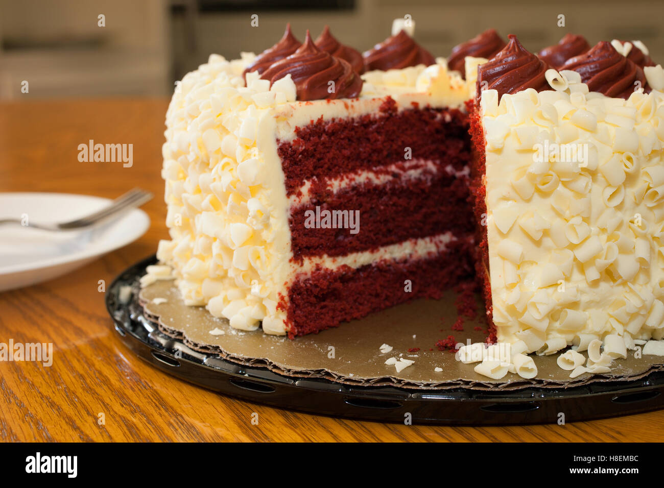Missing piece of the red velvet cake on the table Stock Photo - Alamy