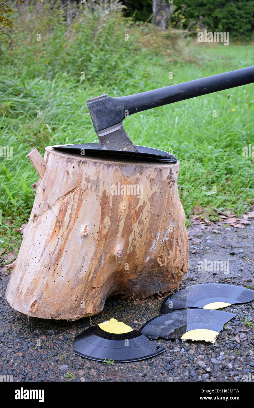 Destroying vinyl albums with axe Stock Photo - Alamy