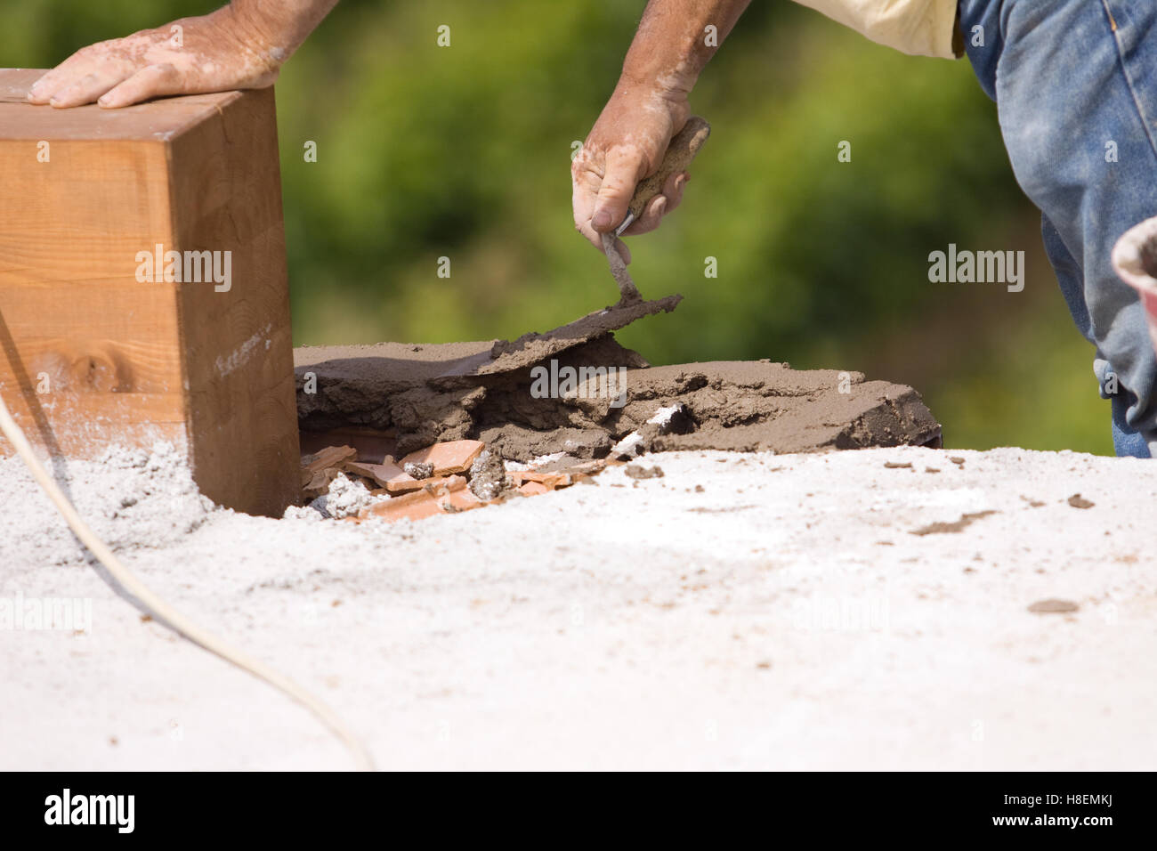 bricklayer working in a building site Stock Photo - Alamy