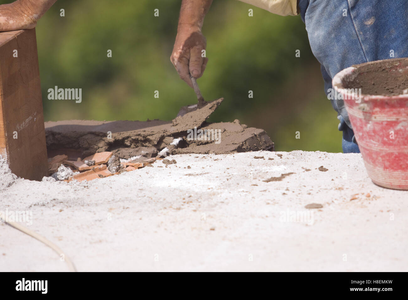 bricklayer working in a building site Stock Photo - Alamy