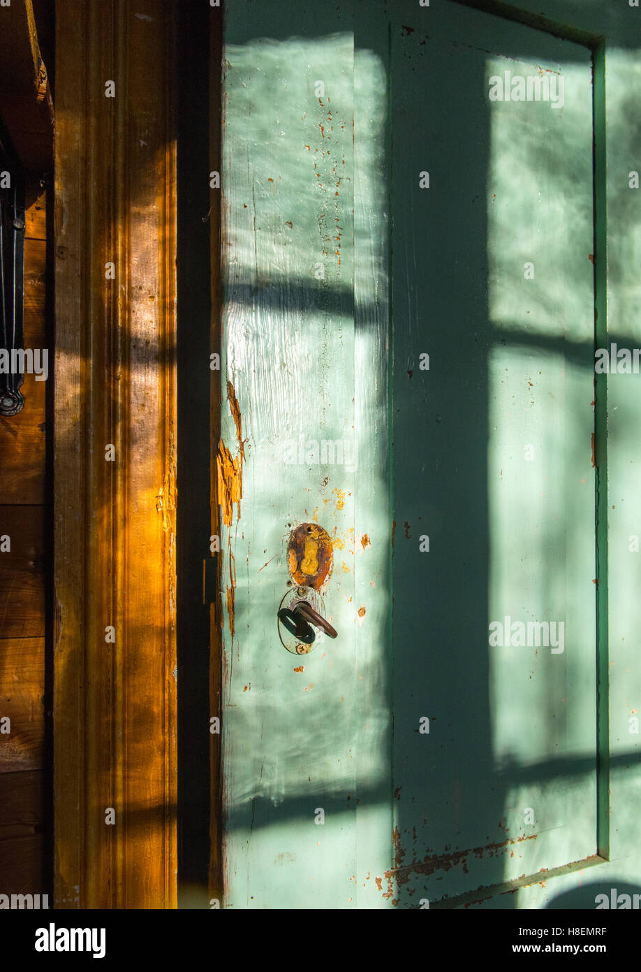 Shadow from a window on an old blue door Stock Photo - Alamy