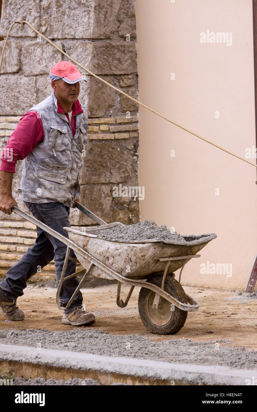 bricklayer working in a building site Stock Photo - Alamy