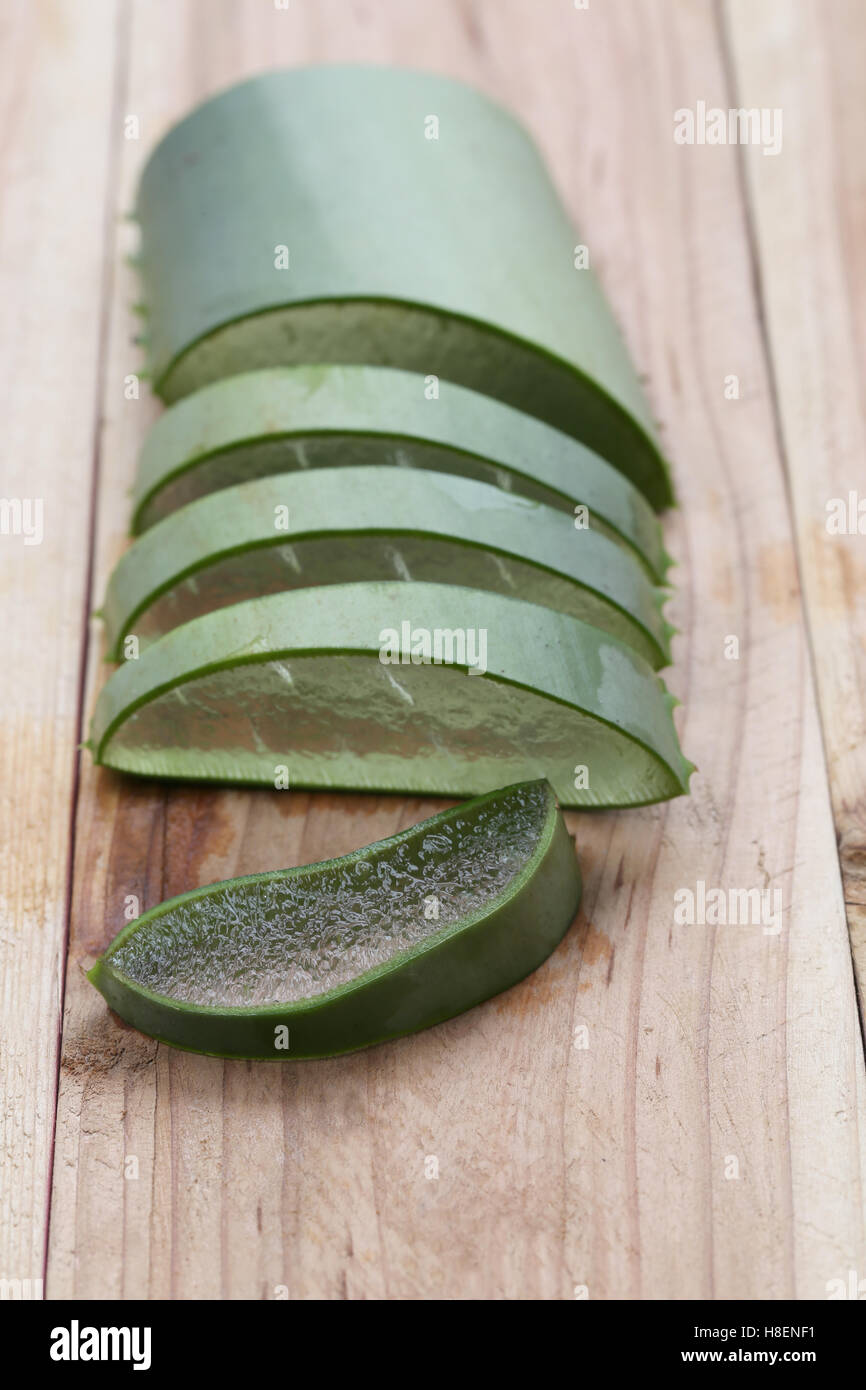 aloe vera slice on wooden floor and can you see texture of aloe vera ...