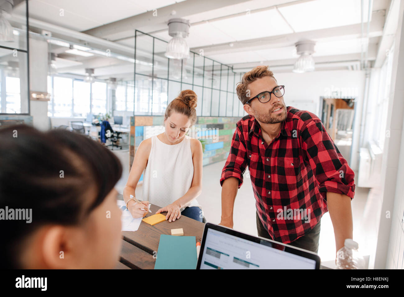 Executives sitting around conference table hi-res stock photography and ...