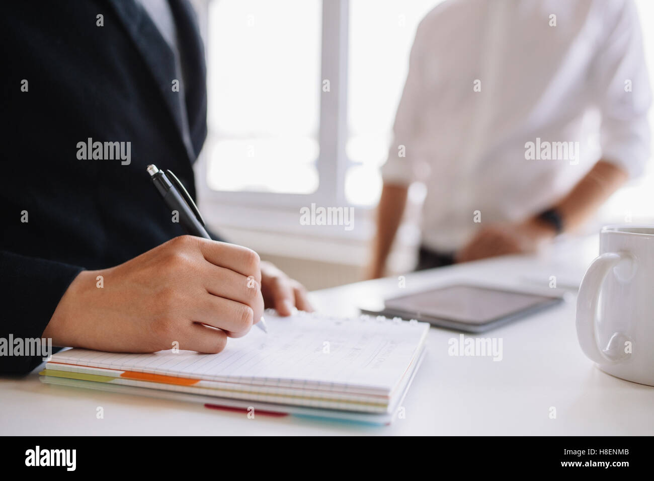 Female employee taking notes on hi-res stock photography and images - Alamy