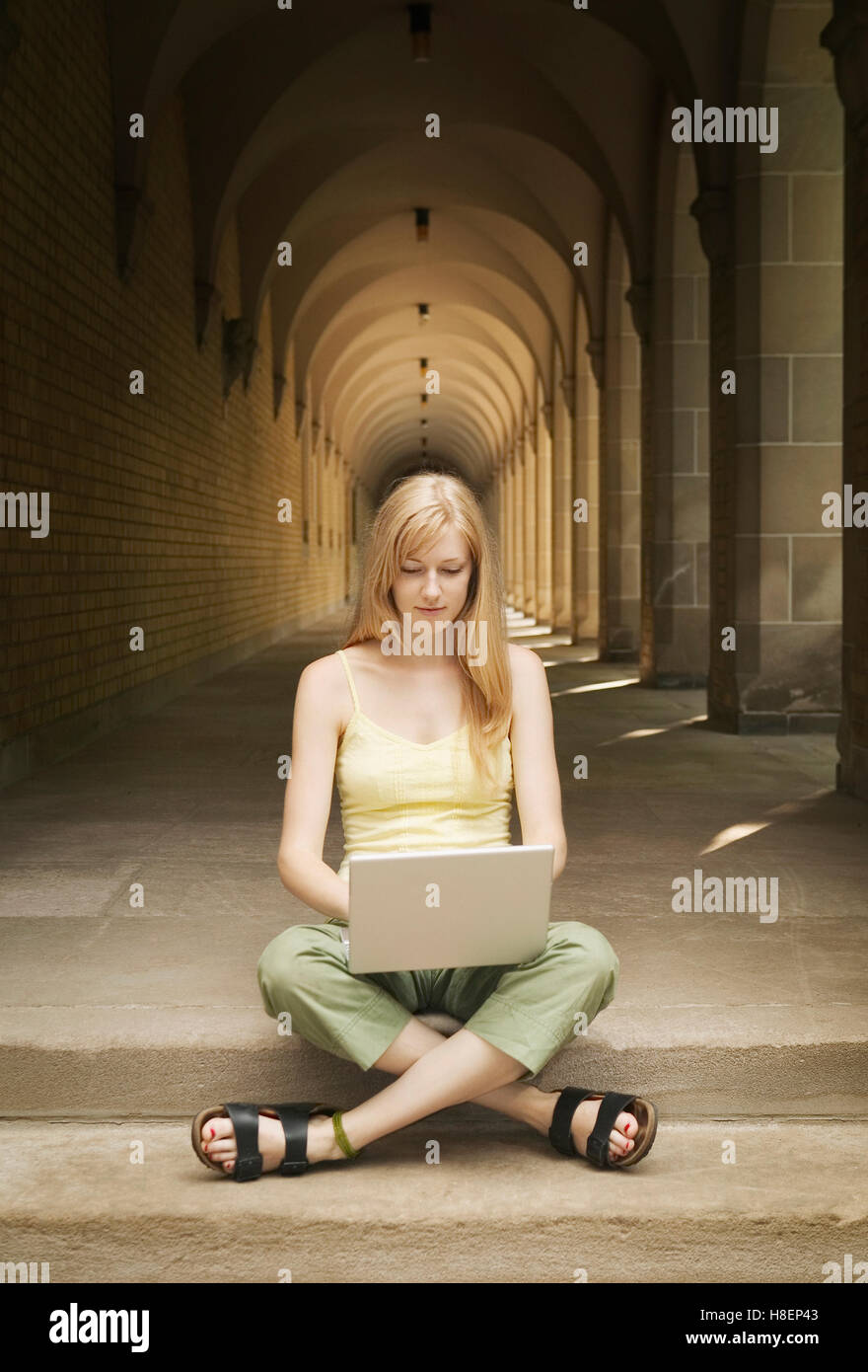 Young woman working on laptop at school Stock Photo - Alamy