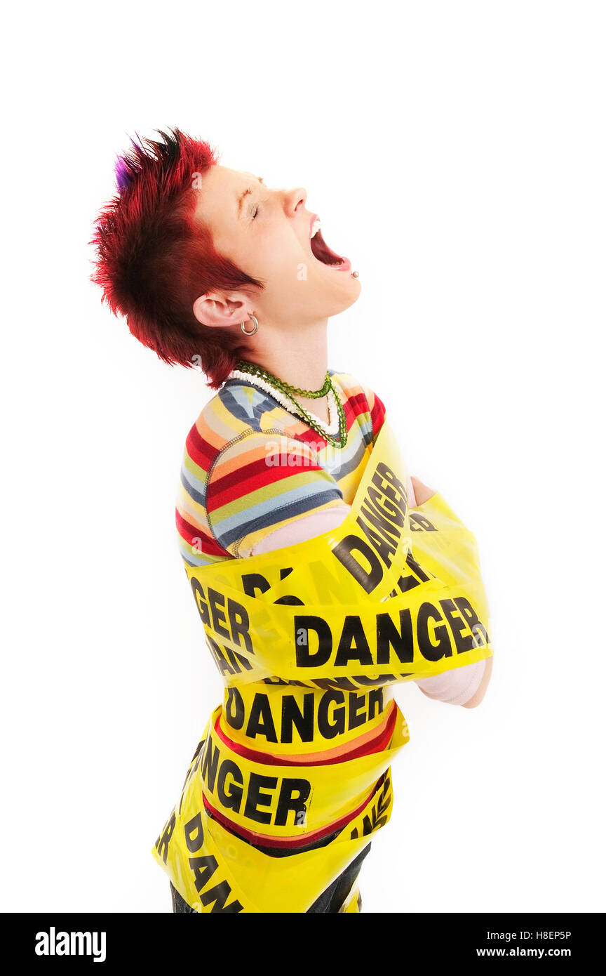 Woman wrapped in danger tape Stock Photo - Alamy
