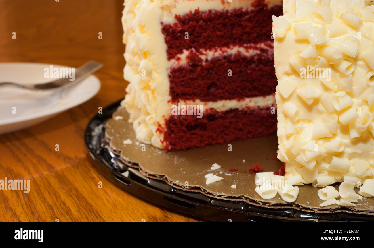 Single slice missing from a red velvet cake Stock Photo - Alamy