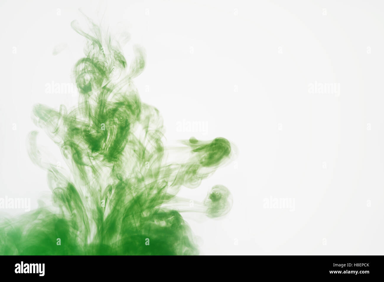green ink poured in water Stock Photo - Alamy