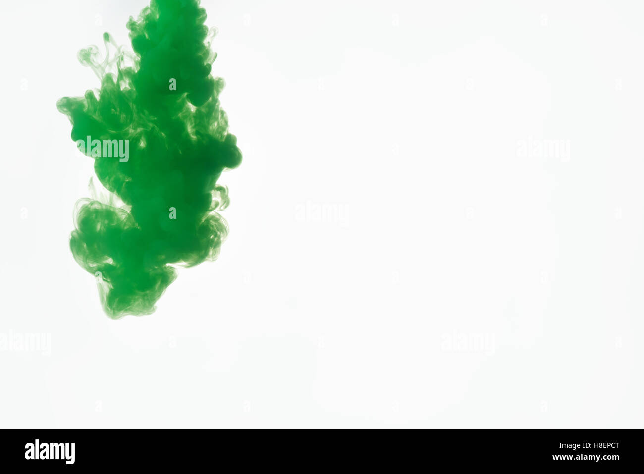 green ink poured in water Stock Photo - Alamy