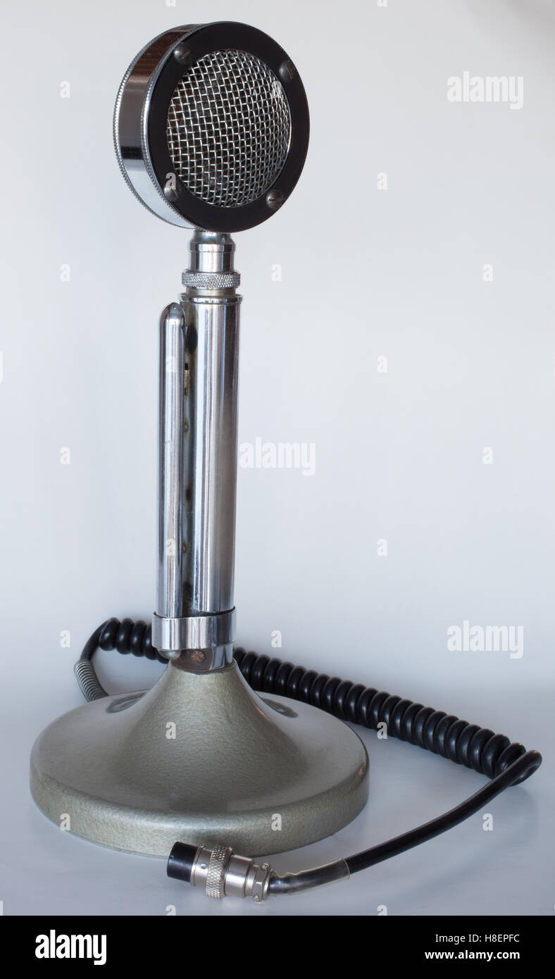 Old microphone and its cable on white background Stock Photo - Alamy