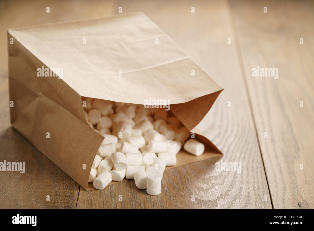 marshmallow in brown craft paper bag on wooden table Stock Photo - Alamy