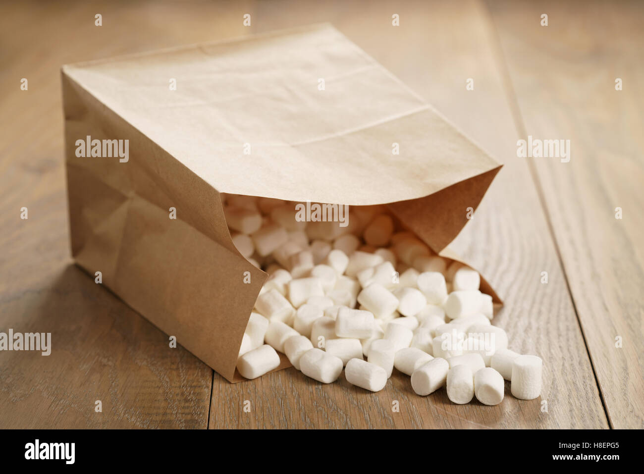 marshmallow in brown craft paper bag on wooden table Stock Photo - Alamy