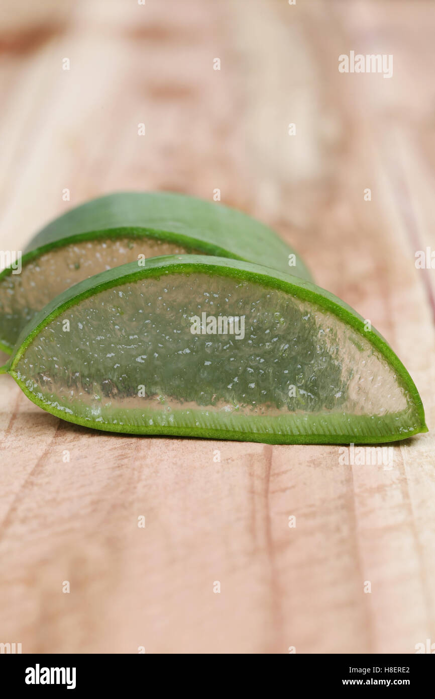 aloe vera slice on wooden floor and can you see texture of aloe vera ...