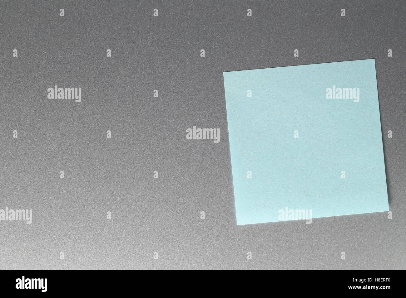 Empty blue paper sheet on refrigerator door for design and input text ...