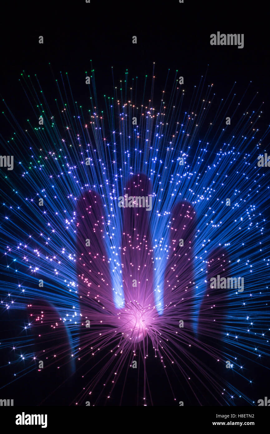 Fiber optics hand hi-res stock photography and images - Alamy