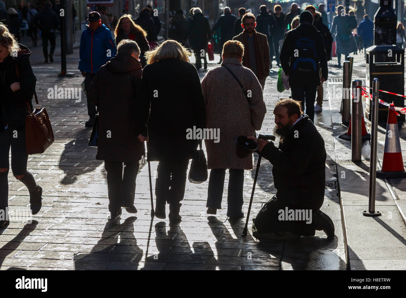 Man on knees begging in hi-res stock photography and images - Alamy