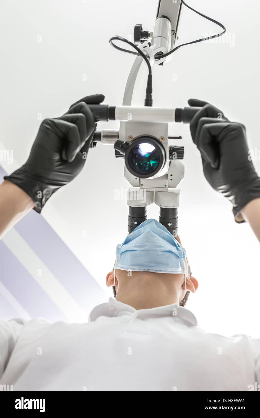 Using a dental microscope Stock Photo - Alamy