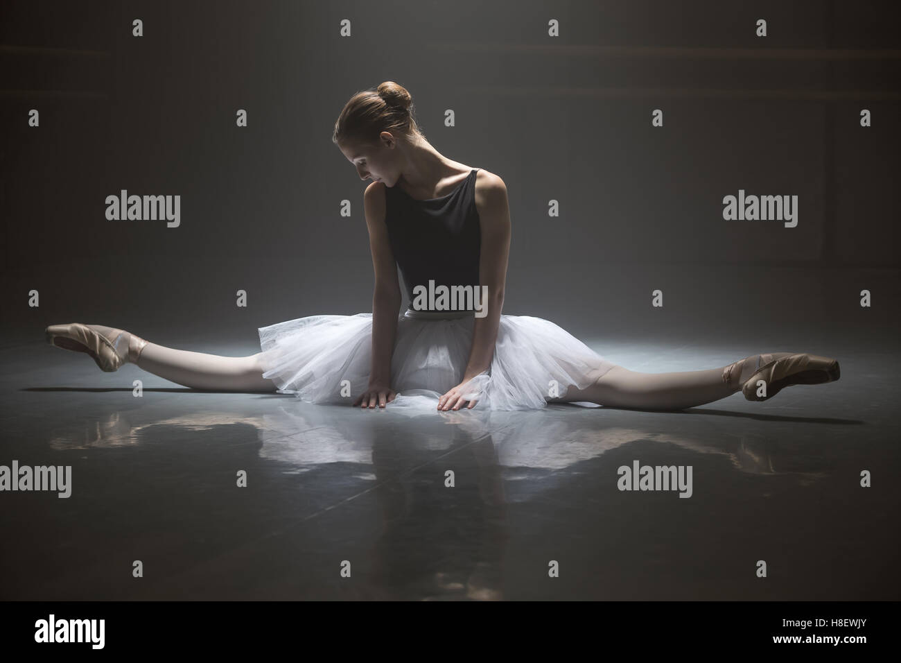 Seated ballerina in class room Stock Photo - Alamy