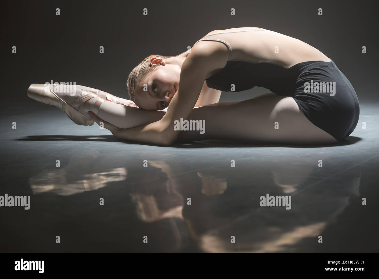 Seated ballerina in class room Stock Photo - Alamy