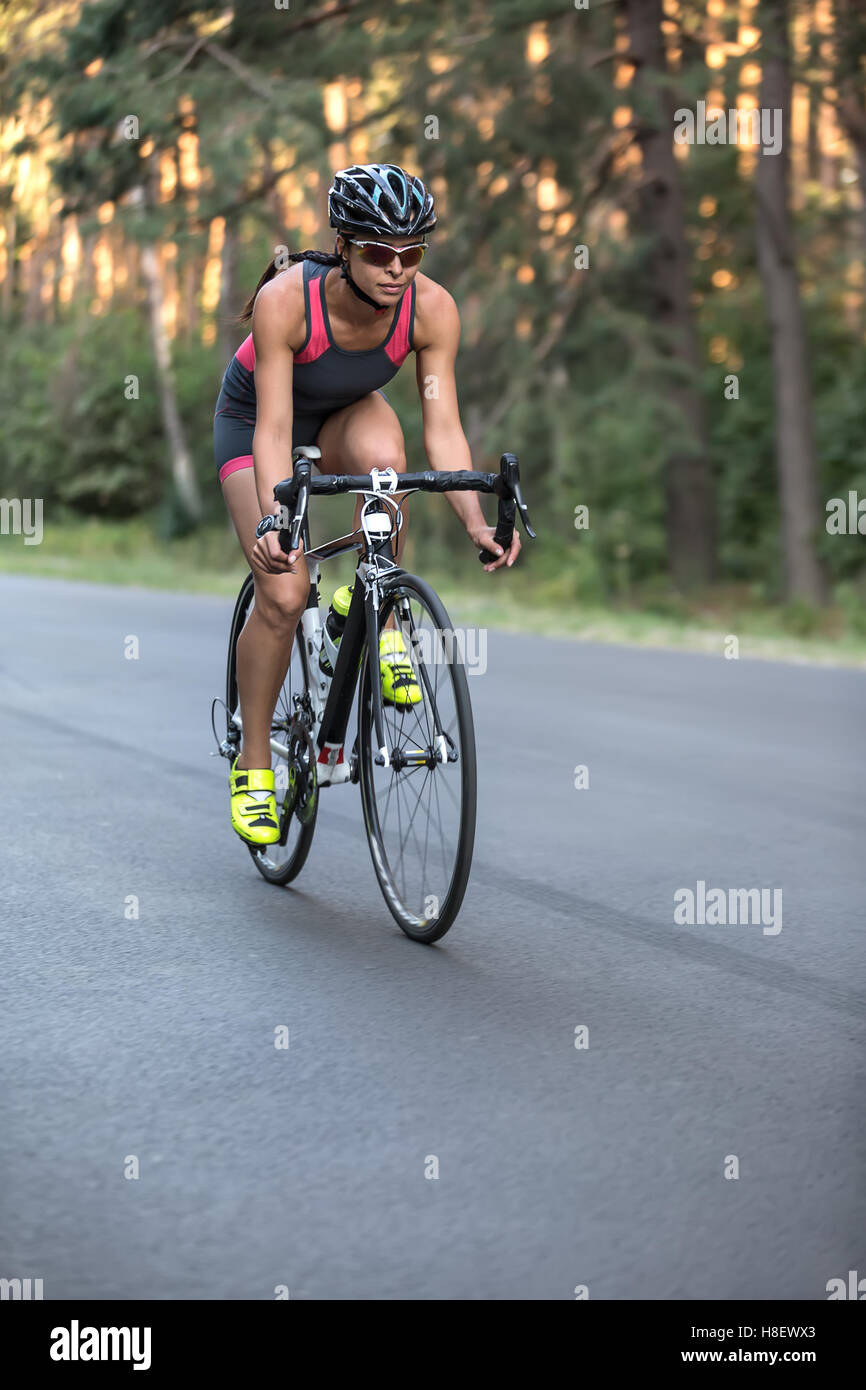 Athletic girl rides a bike Stock Photo - Alamy
