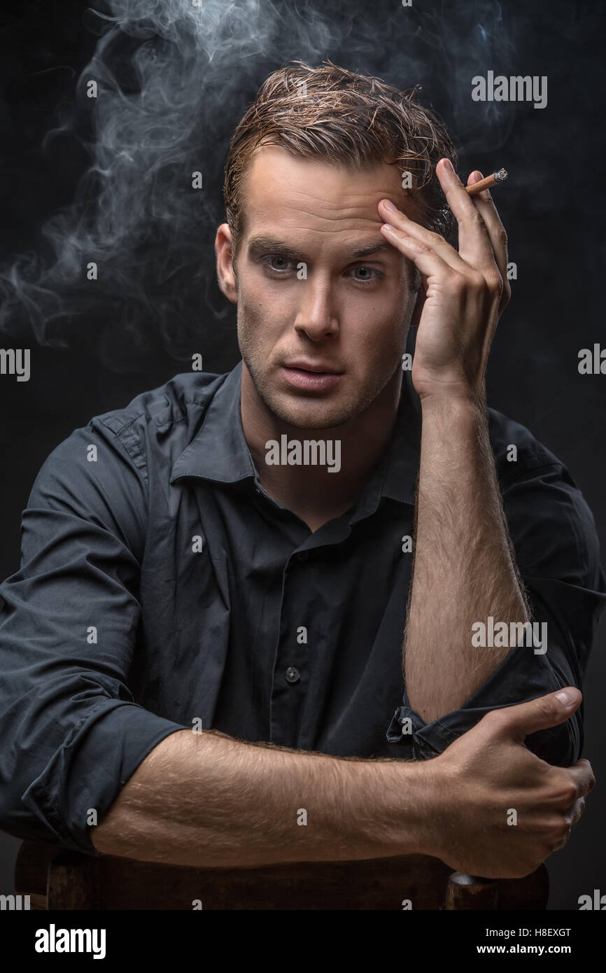Portrait of man with cigarette Stock Photo - Alamy