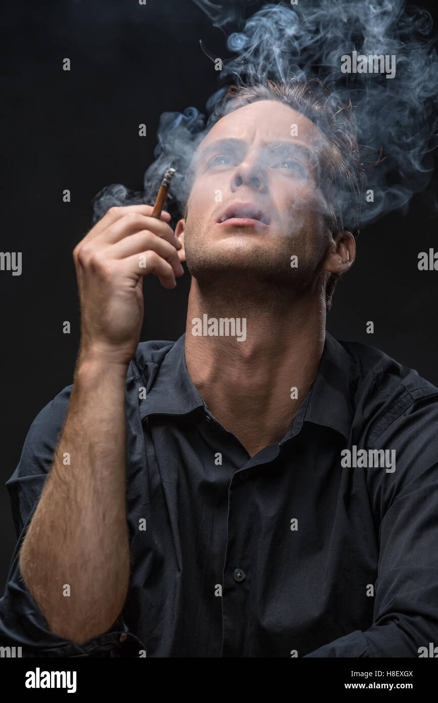 Portrait of man with cigarette Stock Photo - Alamy