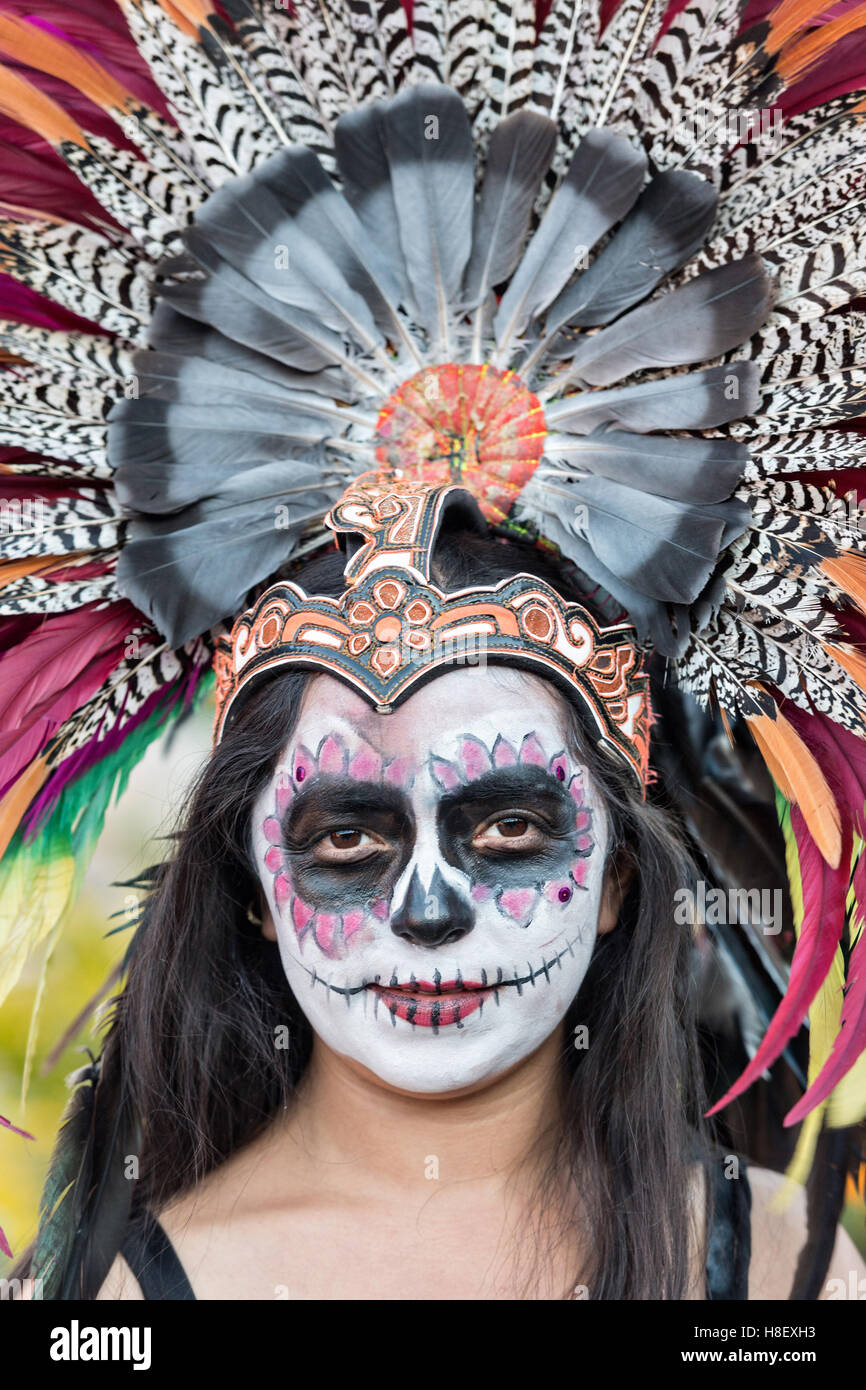 A young woman dressed as an Aztec skeleton during the Day of the Dead ...