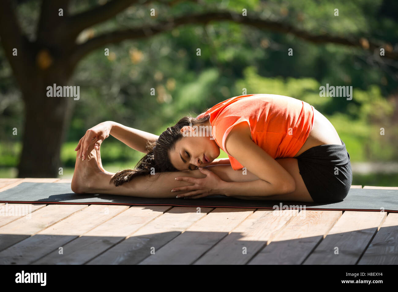 Girl seated forward bend Stock Photo - Alamy Girl seated forward bend Stock Photo - Alamy