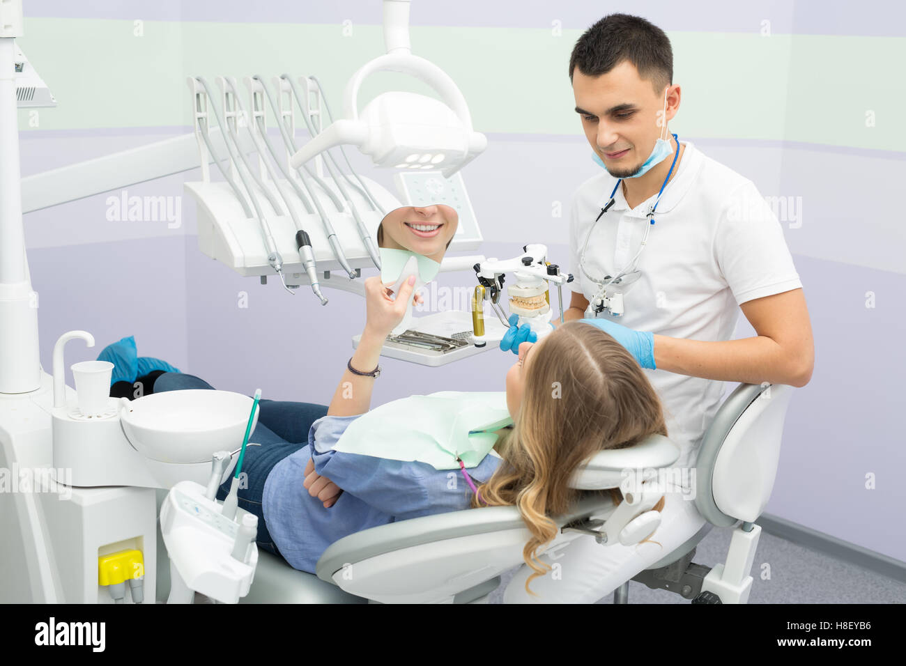 Modern dental clinic, young dentist working Stock Photo - Alamy