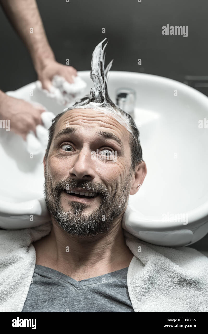 Stylish man in barbershop Stock Photo - Alamy