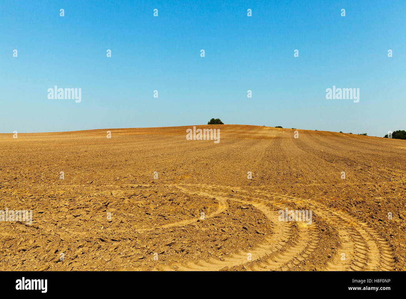 Wheel tracks on the field Stock Photo - Alamy