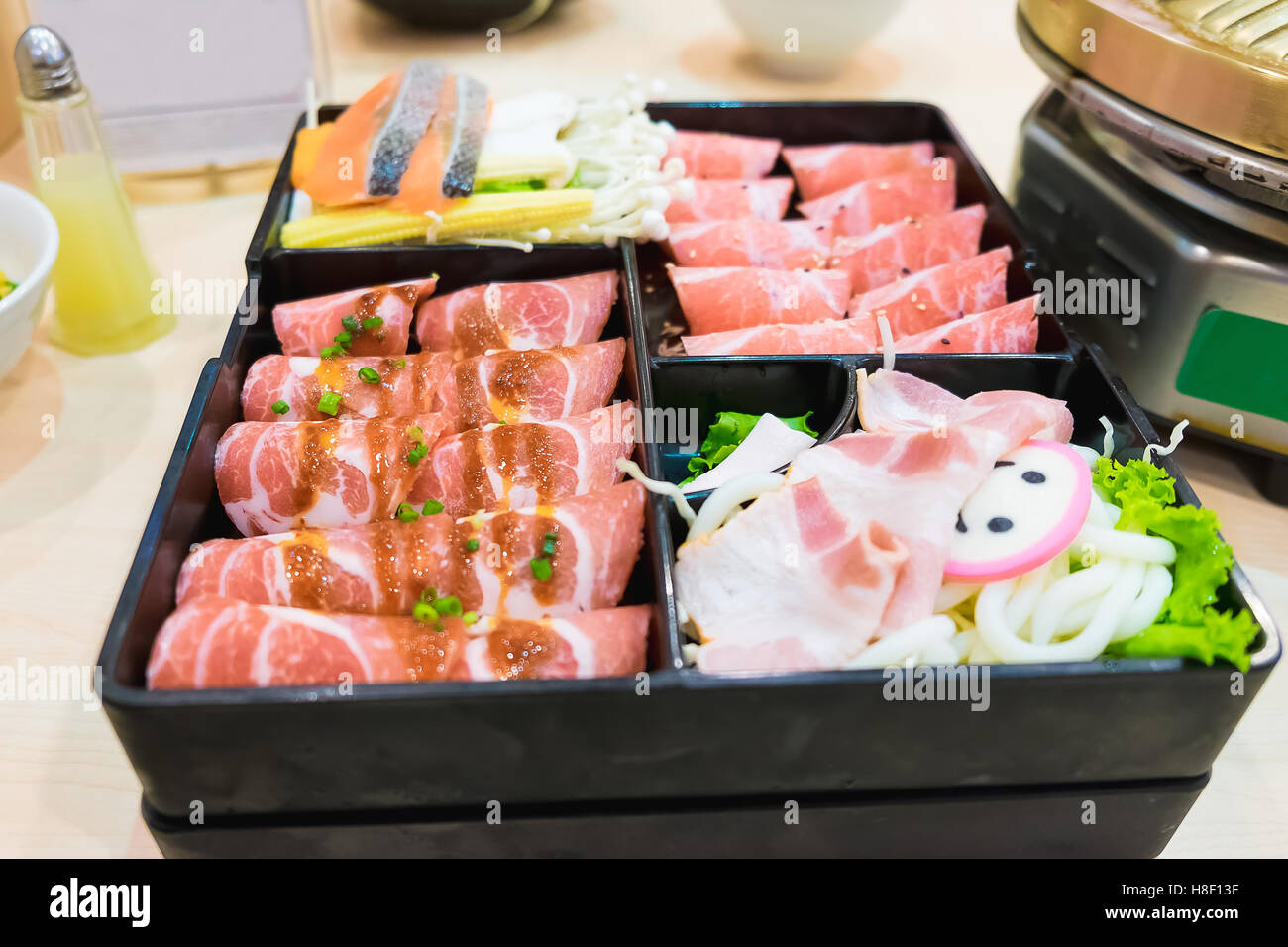 Pink kamaboko sliced, japanese fish cake, pork belly sliced and ...