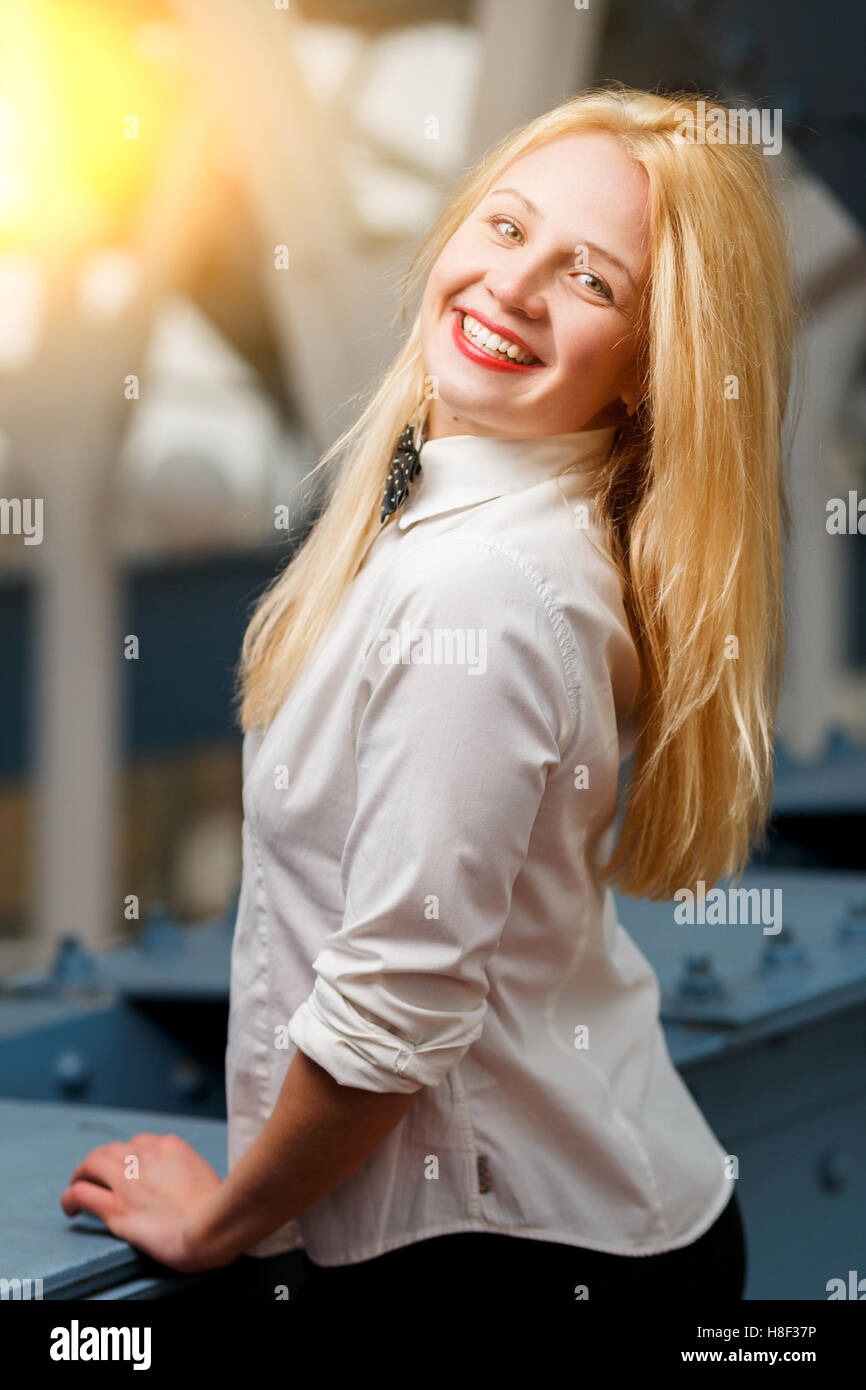Beautiful ginger girl in white shirt standing indoors Stock Photo - Alamy