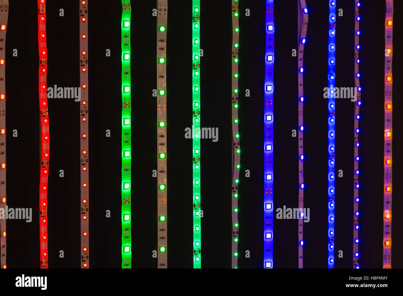 Glowing led stripes different colours on black Stock Photo - Alamy