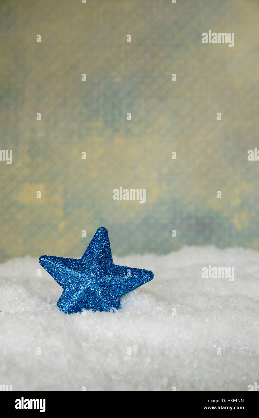 shining blue star decoration in white snow Stock Photo - Alamy