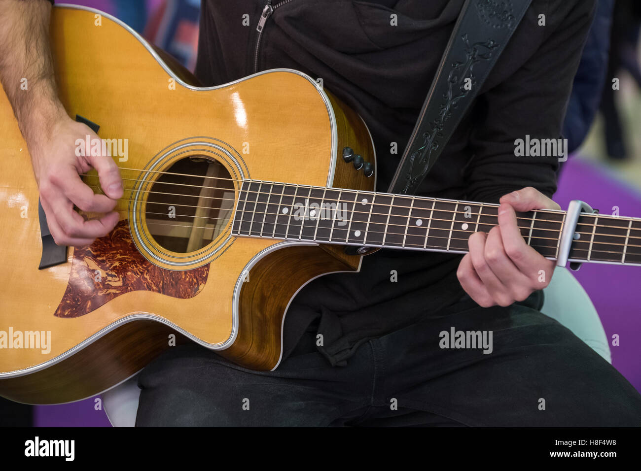 Man plays acoustic guitar Stock Photo - Alamy