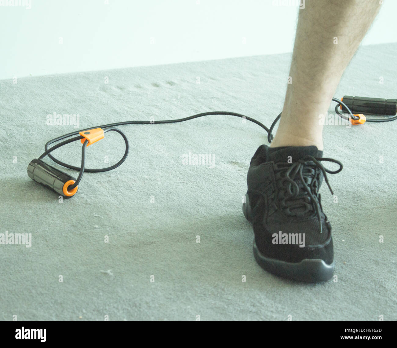 Performing exercises with resistance rope fitness Stock Photo - Alamy