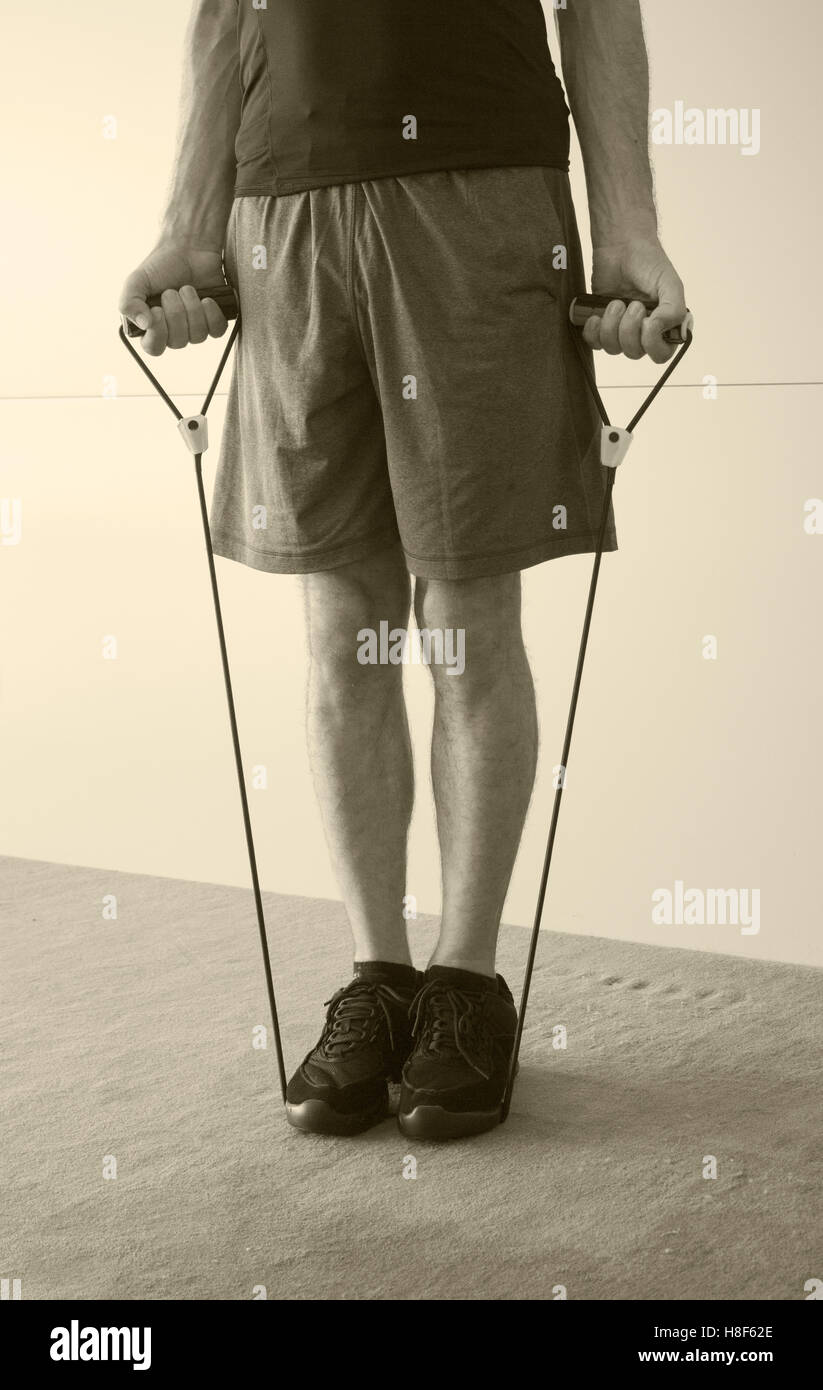 Performing exercises with resistance rope fitness Stock Photo - Alamy