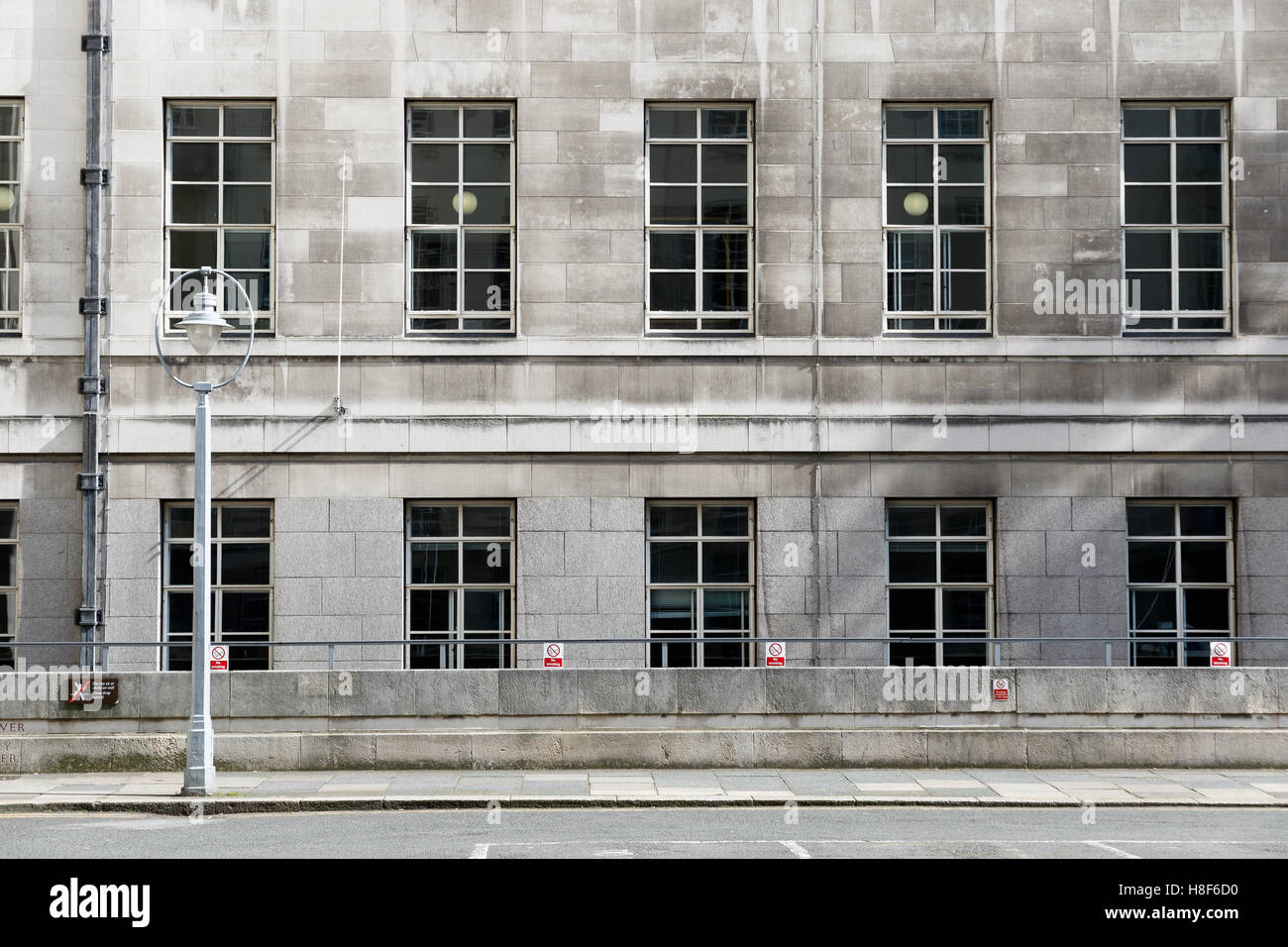 Pedestrian street with geometric windows in the background Stock Photo ...