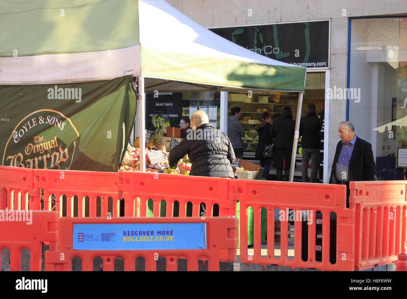 Hull market stall with orange road works barriers Hull city centre ...