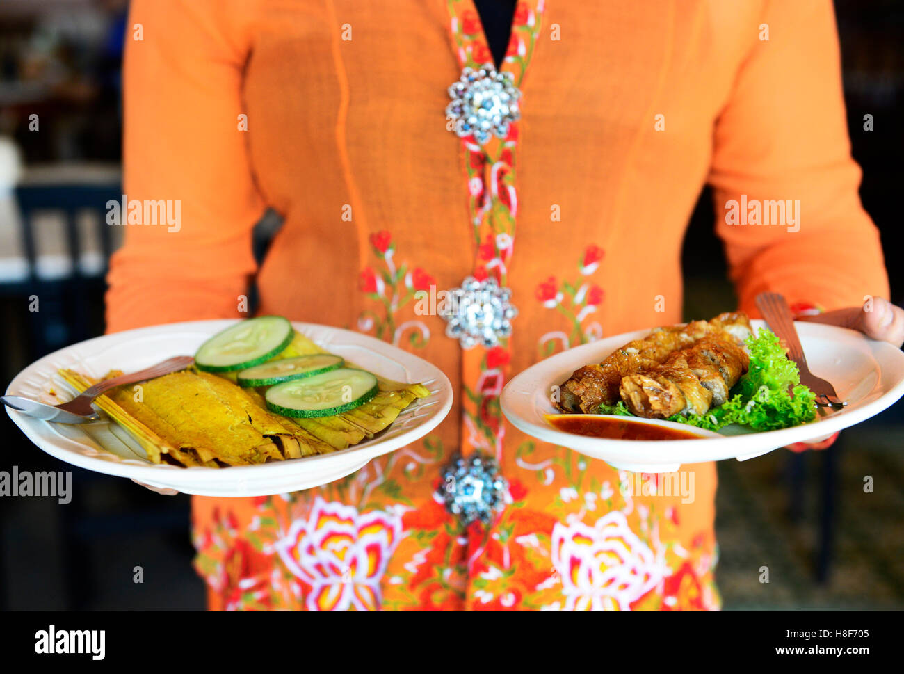 Enjoying variety of Nyonya cuisine dishes Stock Photo - Alamy