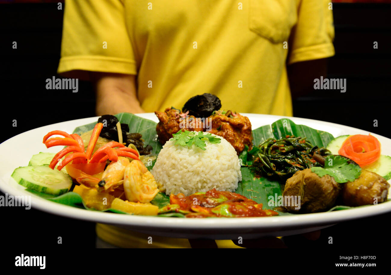 Enjoying variety of Nyonya cuisine dishes Stock Photo - Alamy