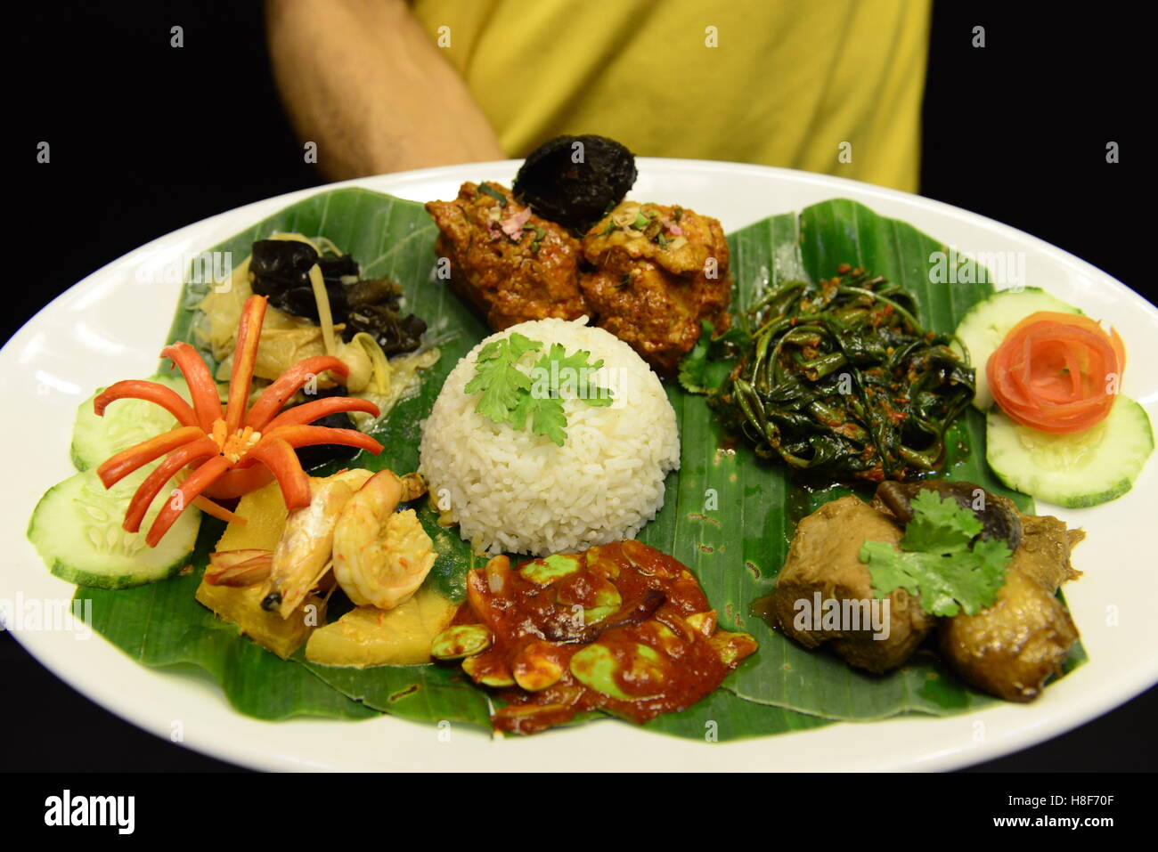 Enjoying variety of Nyonya cuisine dishes Stock Photo - Alamy